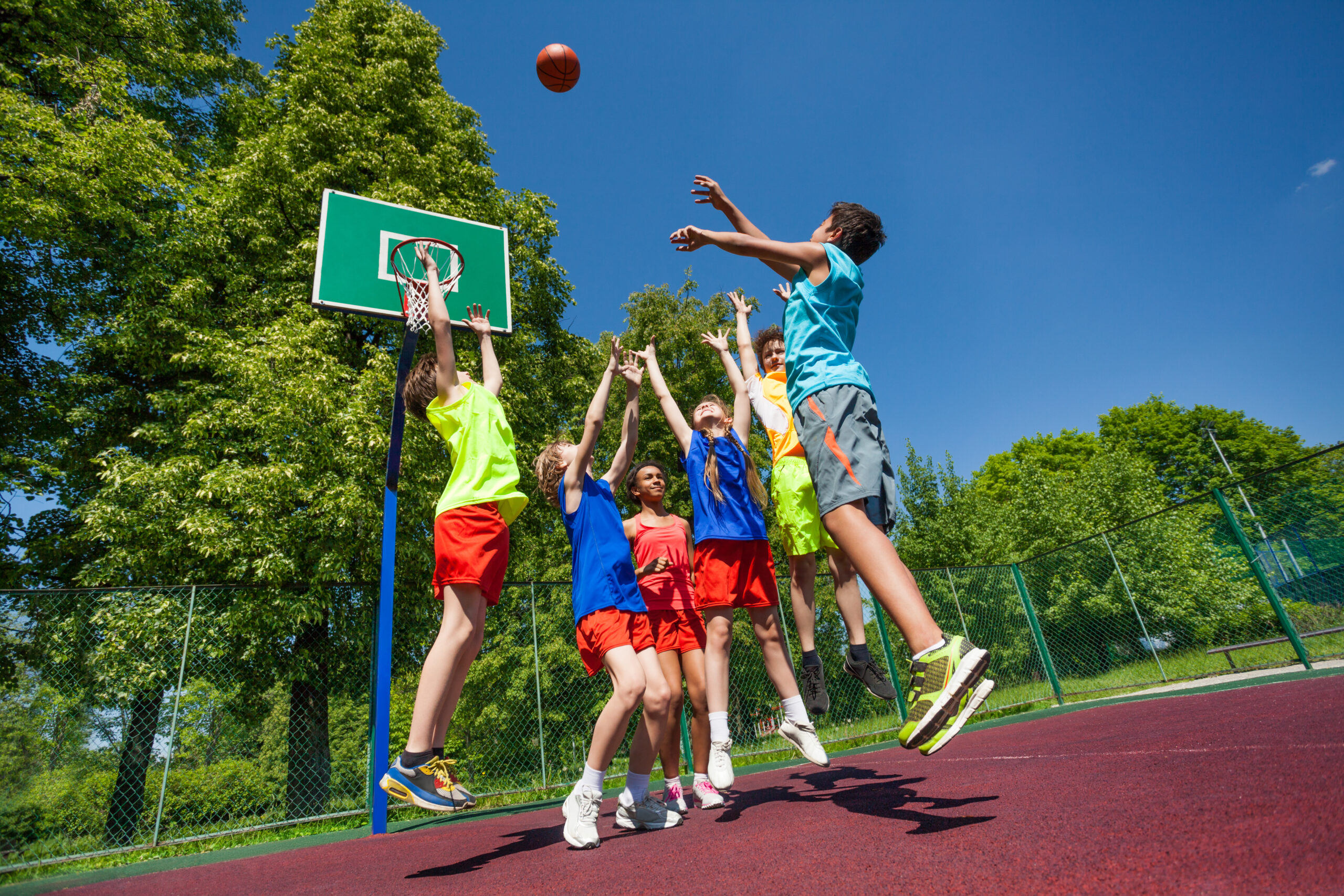 Jumping,For,Ball,Teenagers,Playing,Basketball,Game - Saint Augustine's ...
